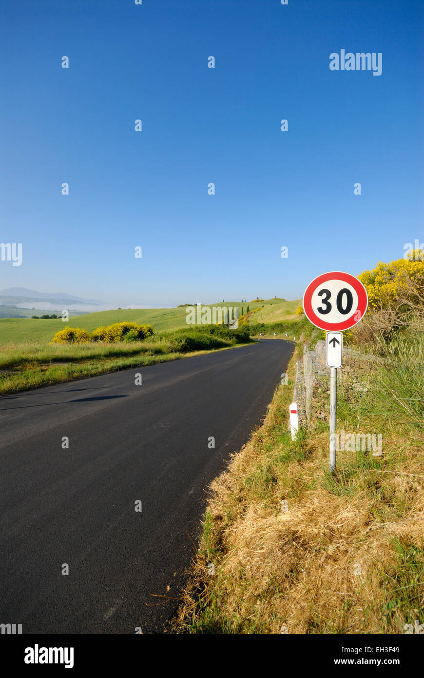 Speed limit sign on highway through landscape, Tuscany, Italy Stock ...
