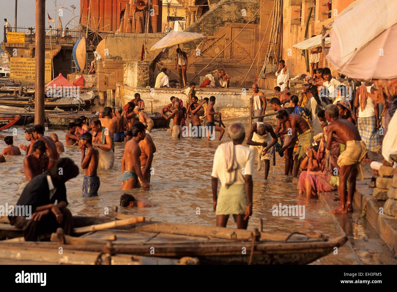 People bathing in the holy water of the Ganges river, Varanasi, India ...