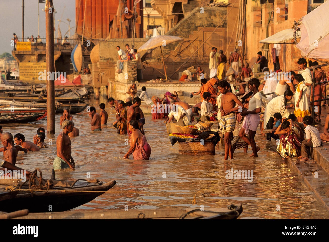 People bathing in the holy water of the Ganges river, Varanasi, India ...