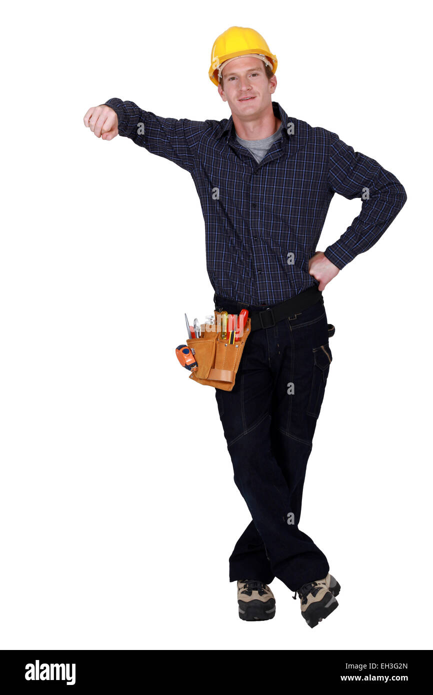 Architect leaning against invisible object Stock Photo - Alamy