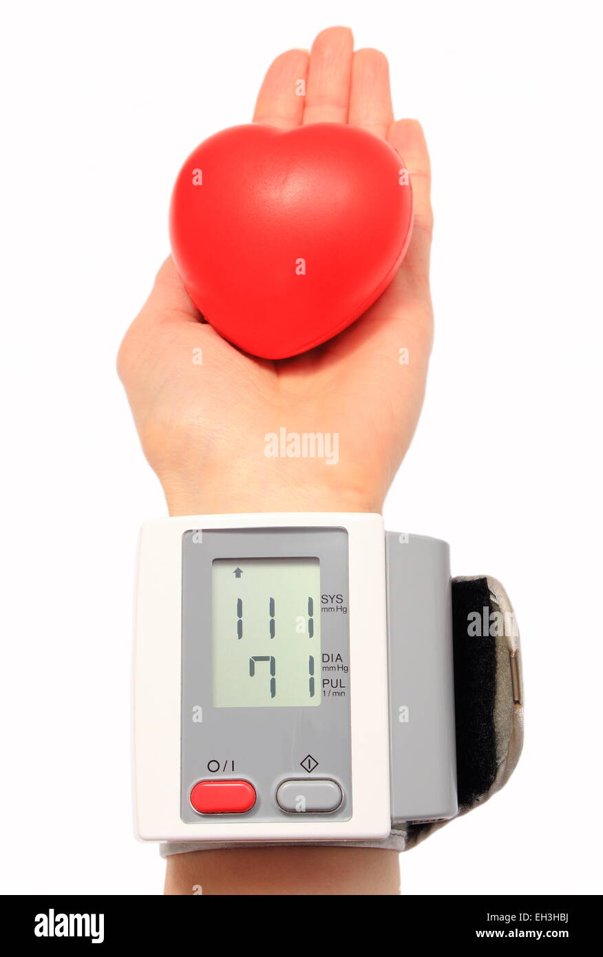 Measuring blood pressure and red heart in hand, blood pressure monitor ...