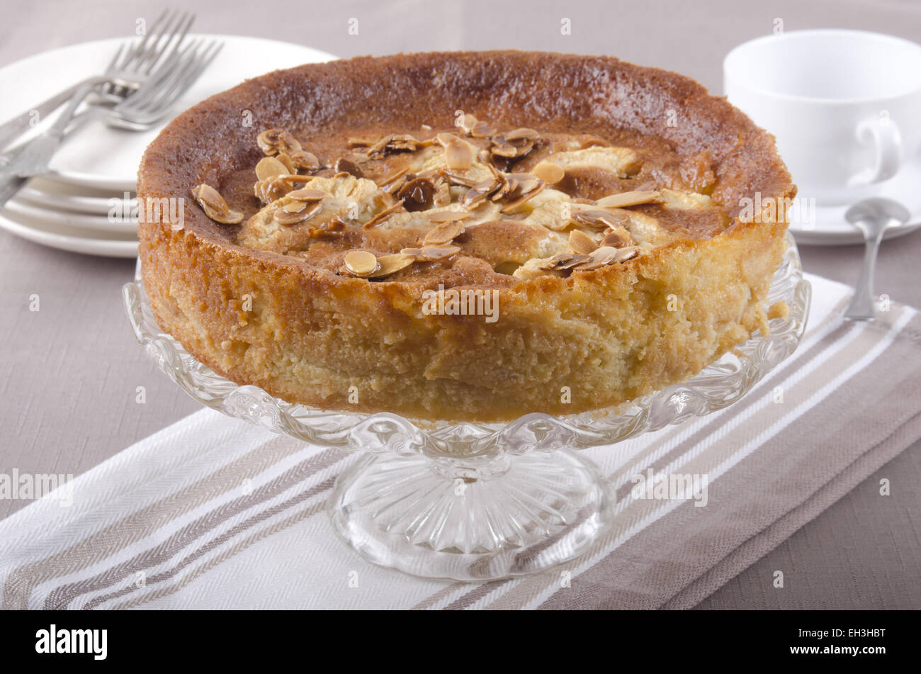 apple cake with almond sliver on a cake stand Stock Photo - Alamy