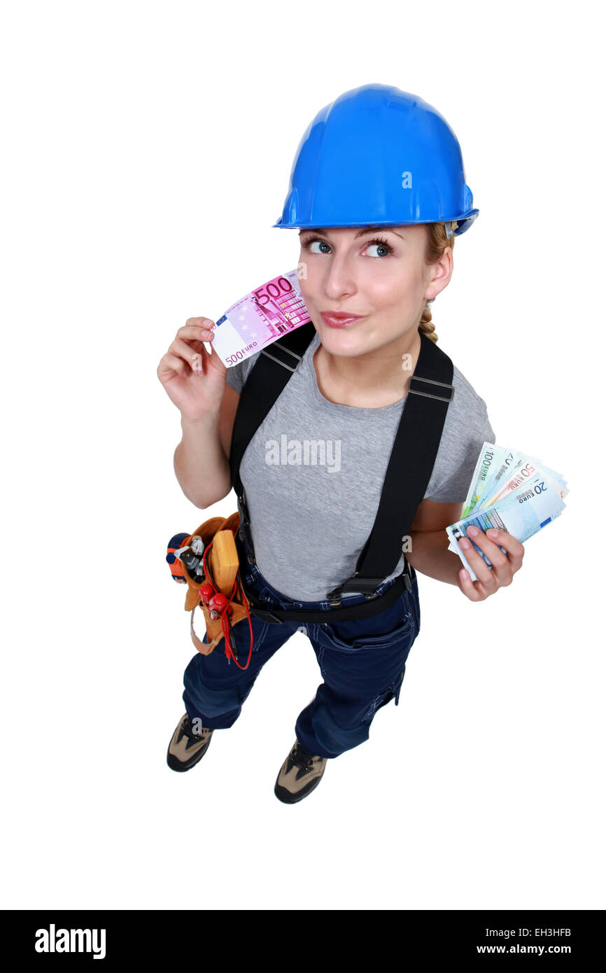 Female electrician with cash Stock Photo - Alamy