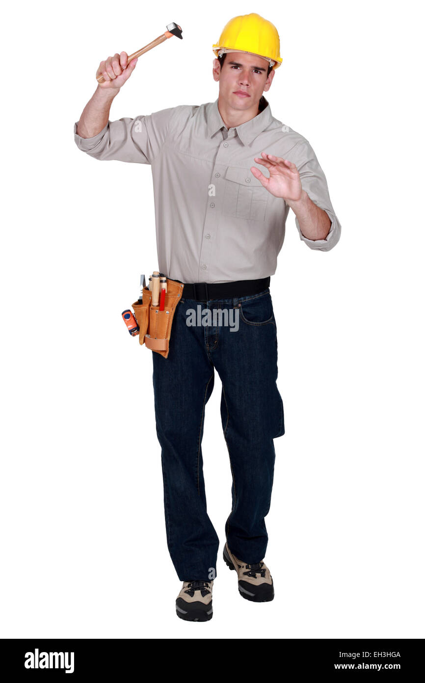 craftsman striking with a hammer Stock Photo - Alamy