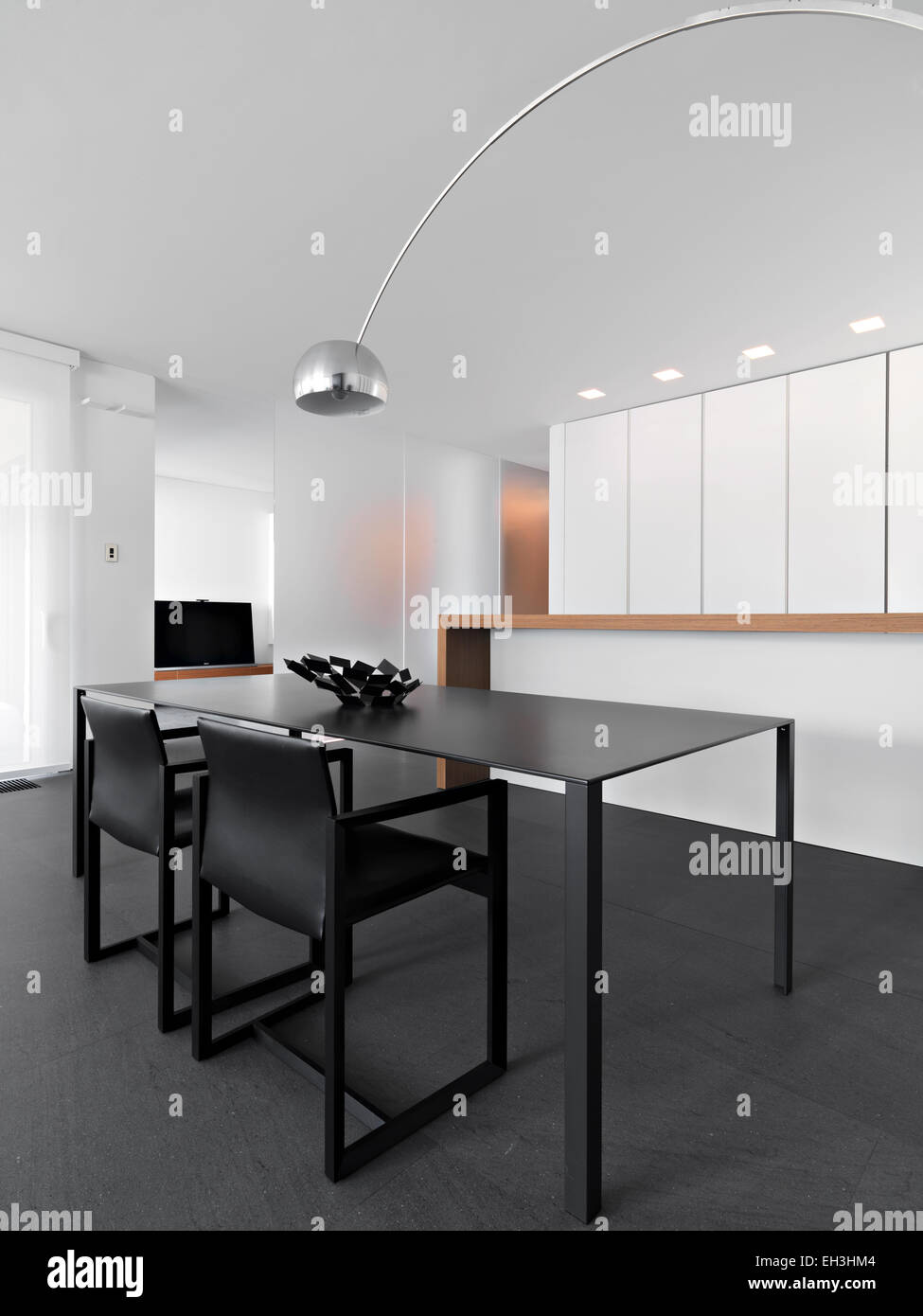 interior view of a modern dining room with dining table in foreground ...