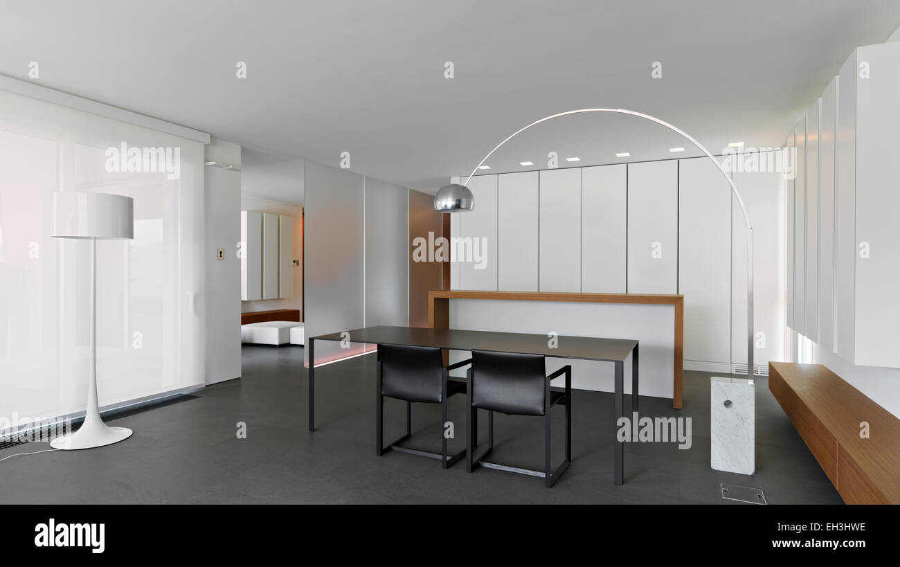 interior view of a modern dining room with dining table in foreground ...