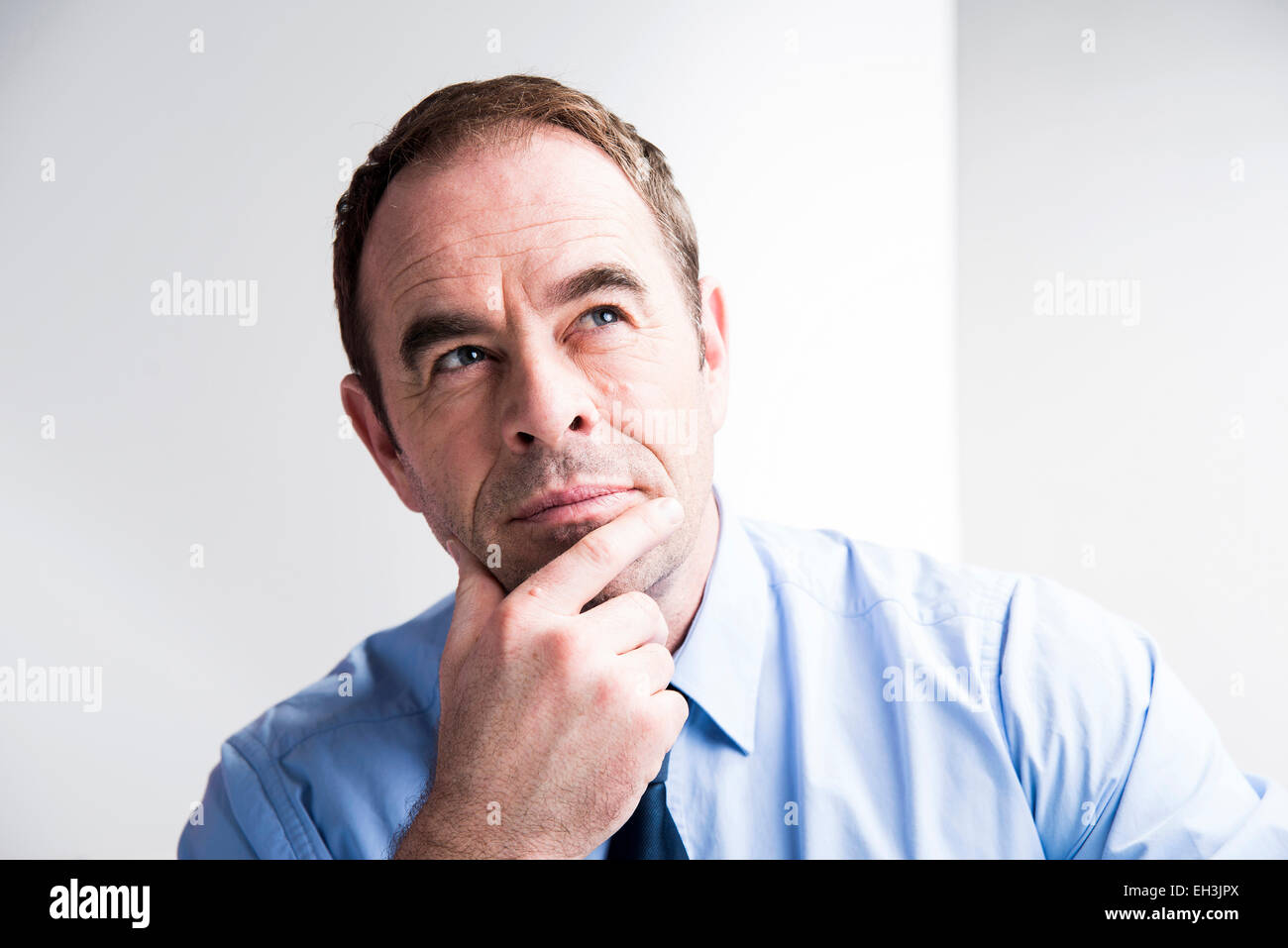 Manager thinking, portrait Stock Photo - Alamy