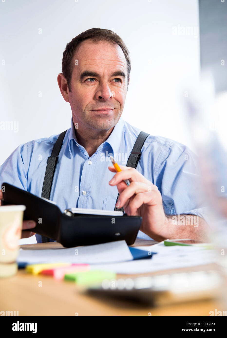 Businessman checking his schedule Stock Photo - Alamy