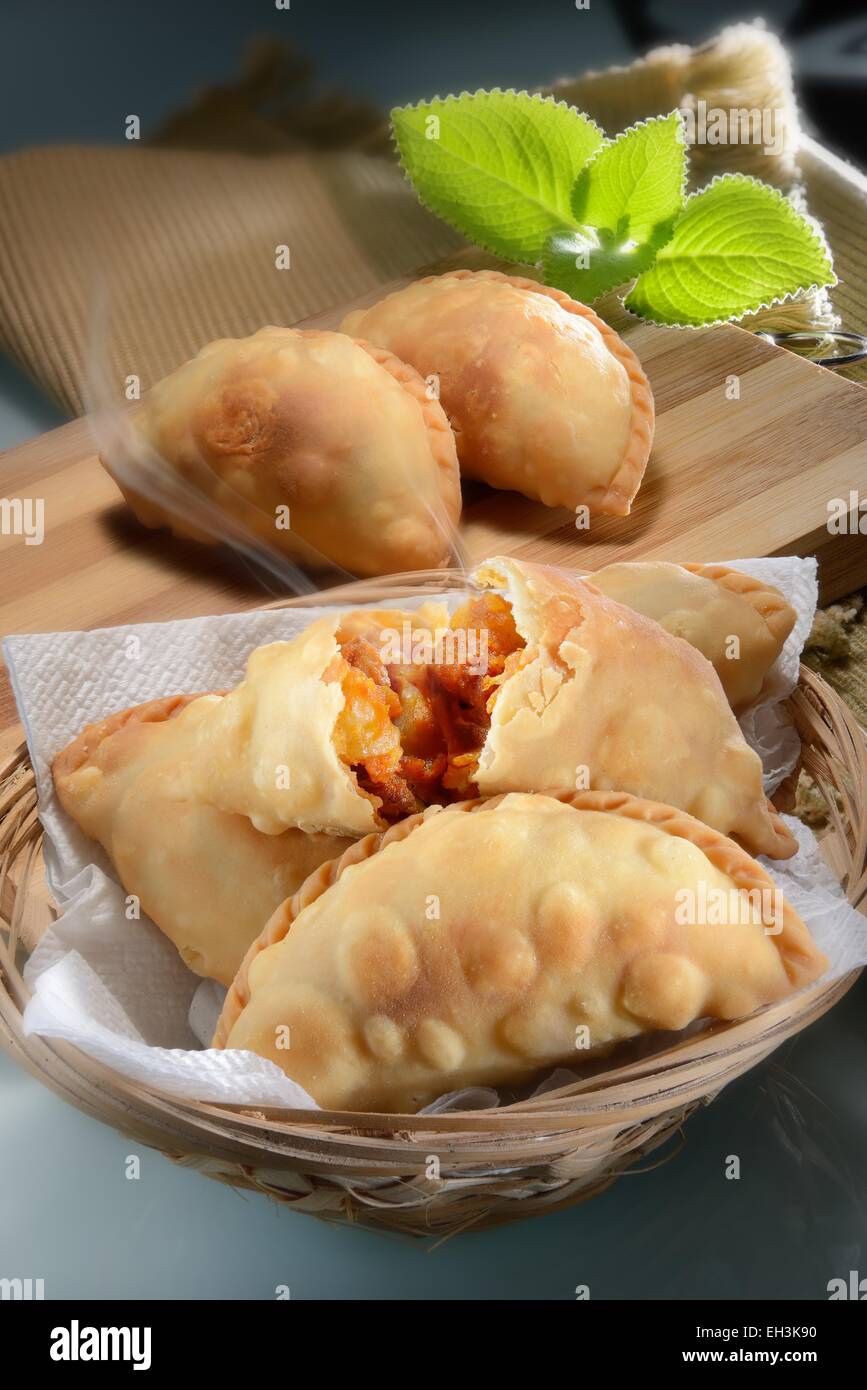 Deep fried curry puffs with nice table setting Stock Photo - Alamy