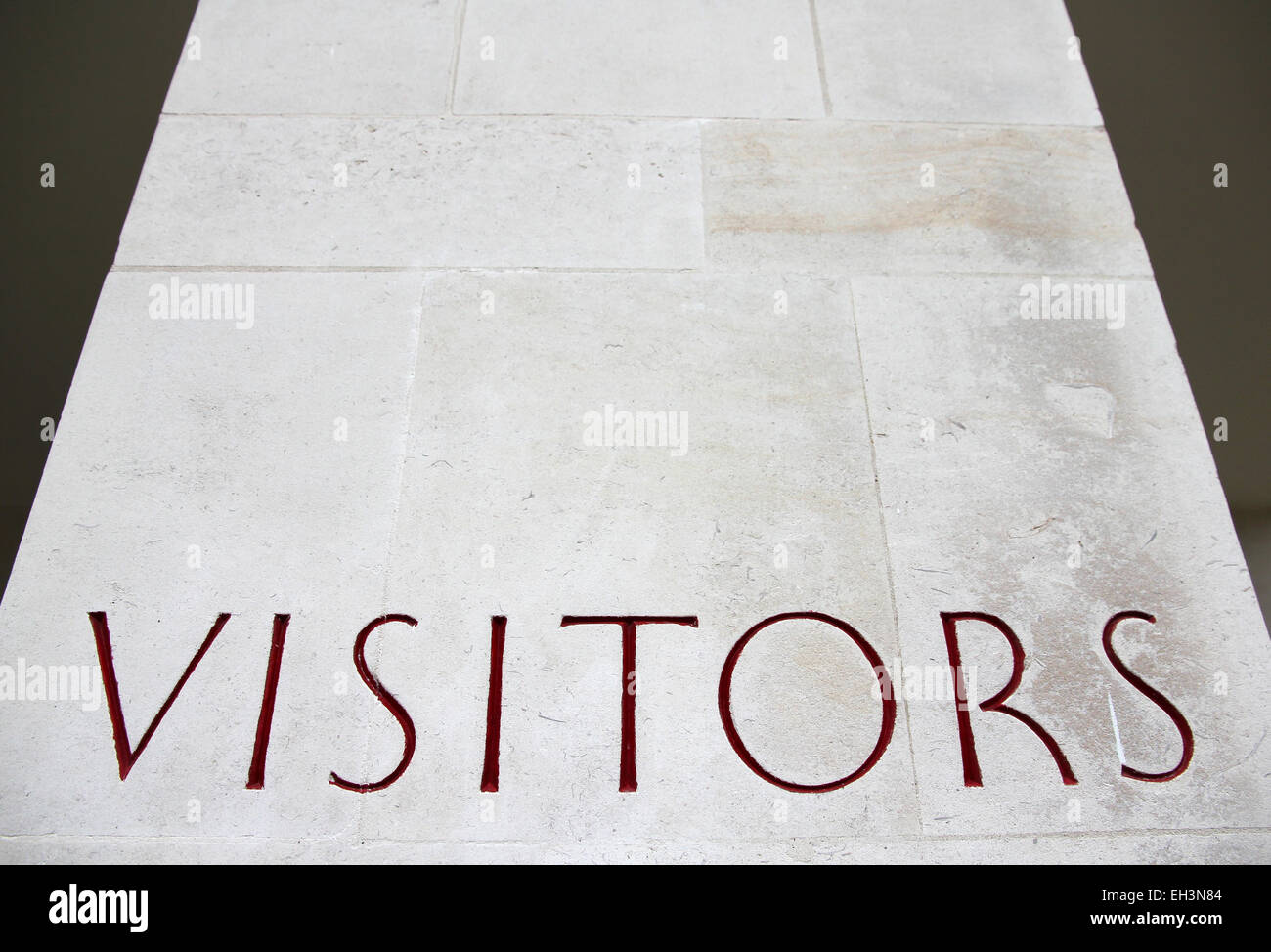 visitors sign engraved on stone wall Stock Photo - Alamy