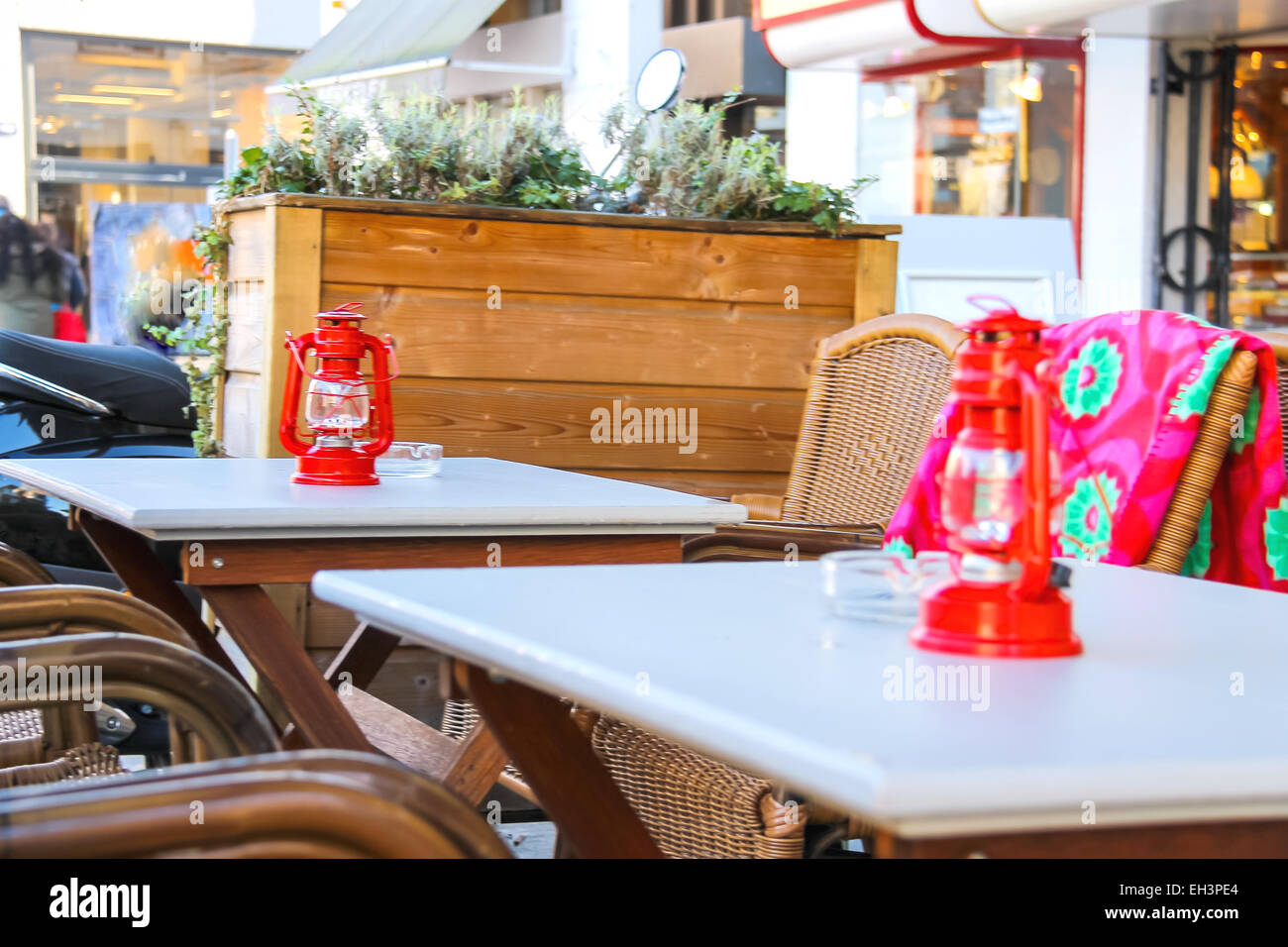 The red lamp stands on a table outdoor cafe Stock Photo - Alamy