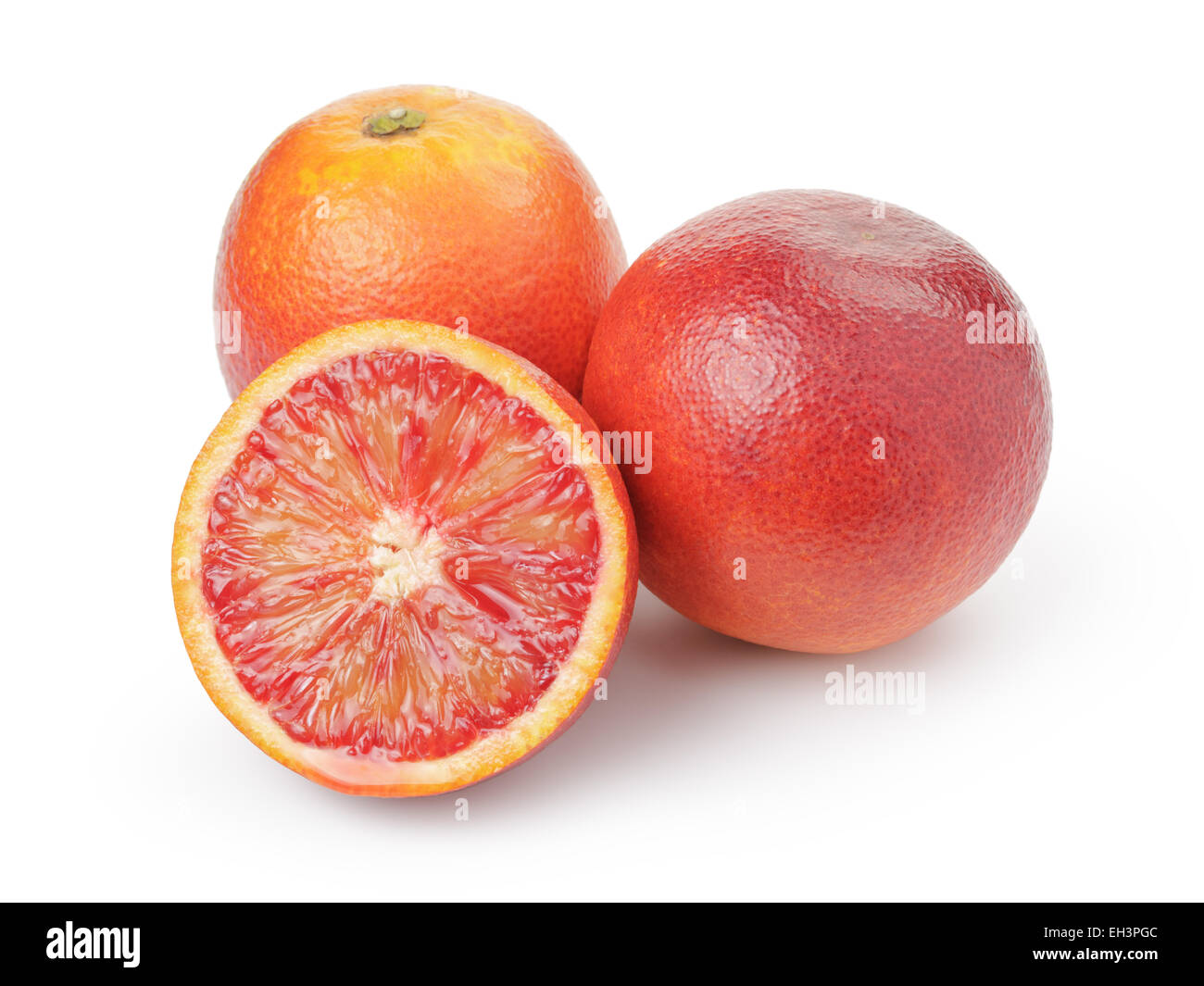 ripe blood red oranges with half isolated on white Stock Photo - Alamy