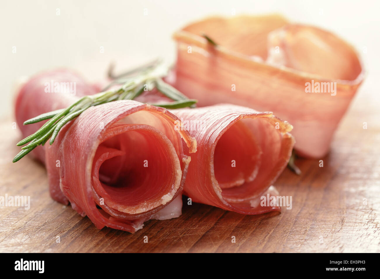 dried jamon slices on wood table, spanish food Stock Photo - Alamy