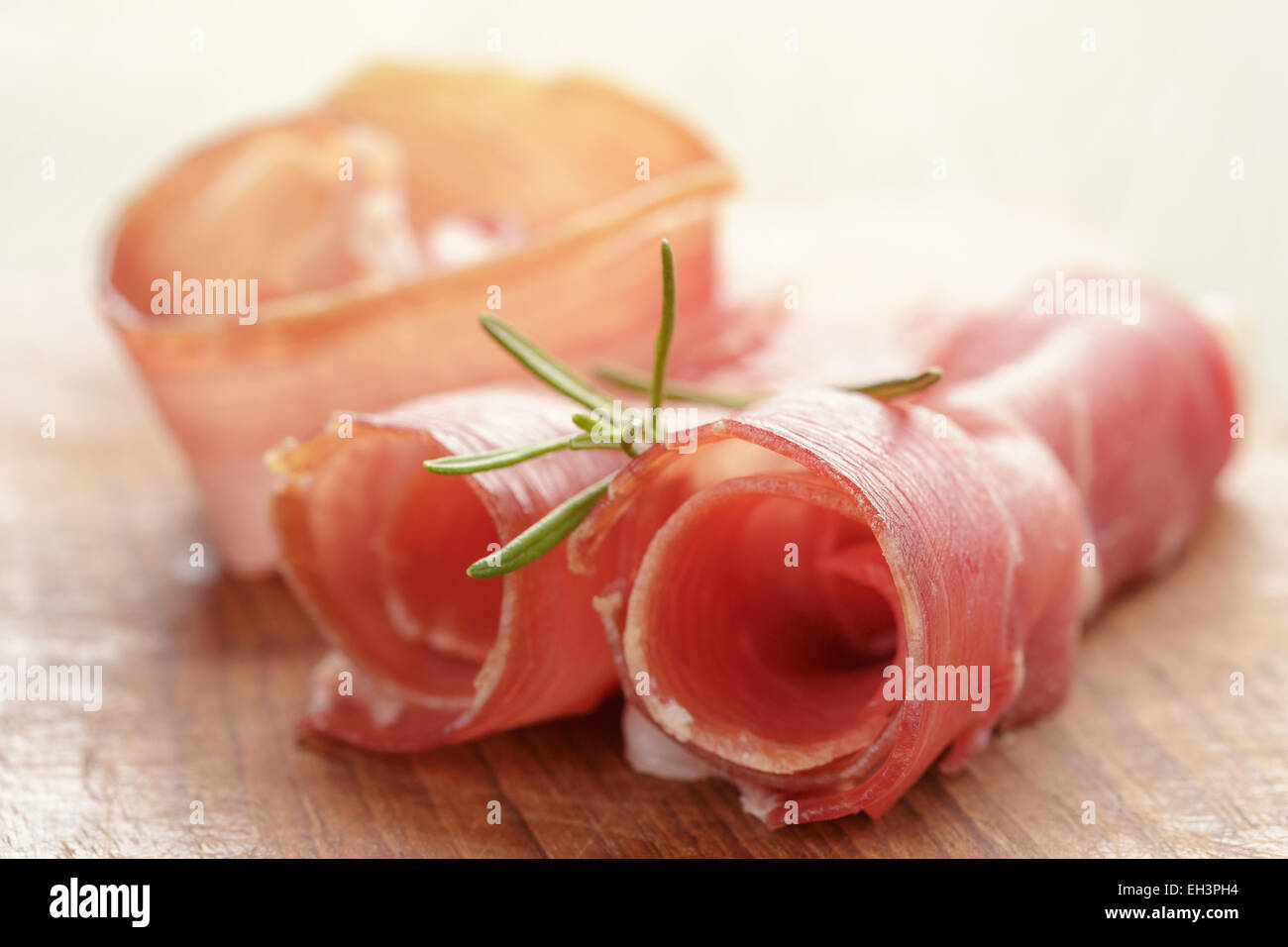 dried jamon slices on wood table, spanish food Stock Photo - Alamy