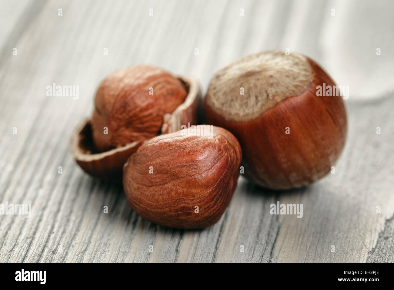 Peeled hazelnuts on old hi-res stock photography and images - Alamy