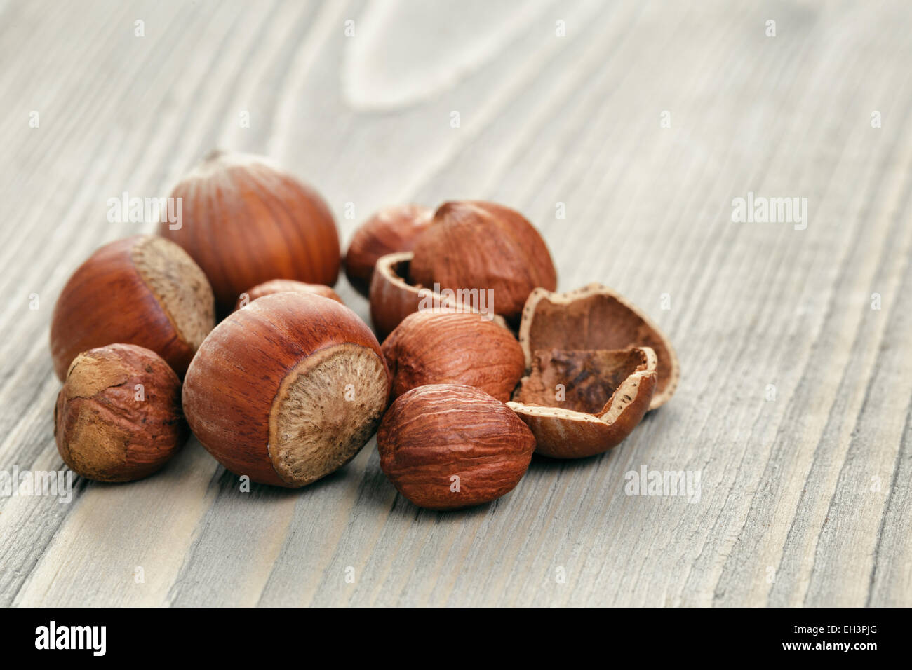 Peeled hazelnuts on old hi-res stock photography and images - Alamy