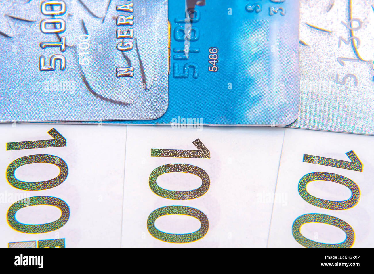 Credit cards and cash close-up on a white background Stock Photo - Alamy