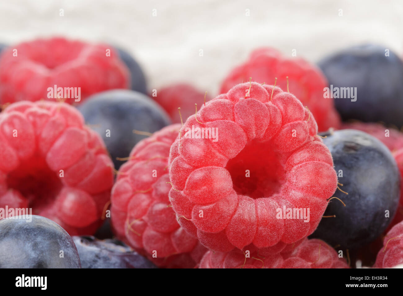 close up photo of ripe blueberry and raspberry Stock Photo - Alamy
