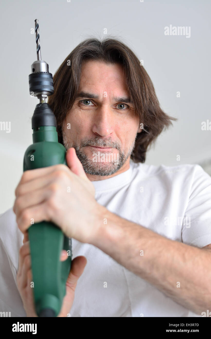 Man with a drill hi-res stock photography and images - Alamy