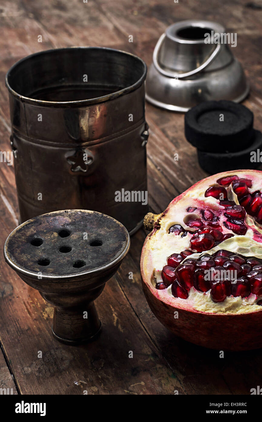 details Shisha and accessories on wooden background.image is tinted in ...