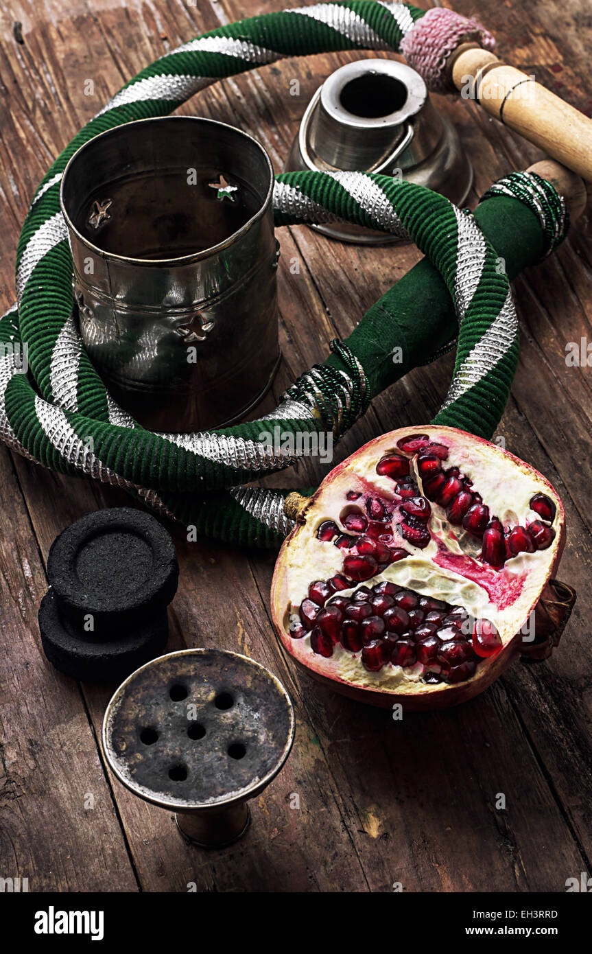 details Shisha and accessories on wooden background.image is tinted in ...