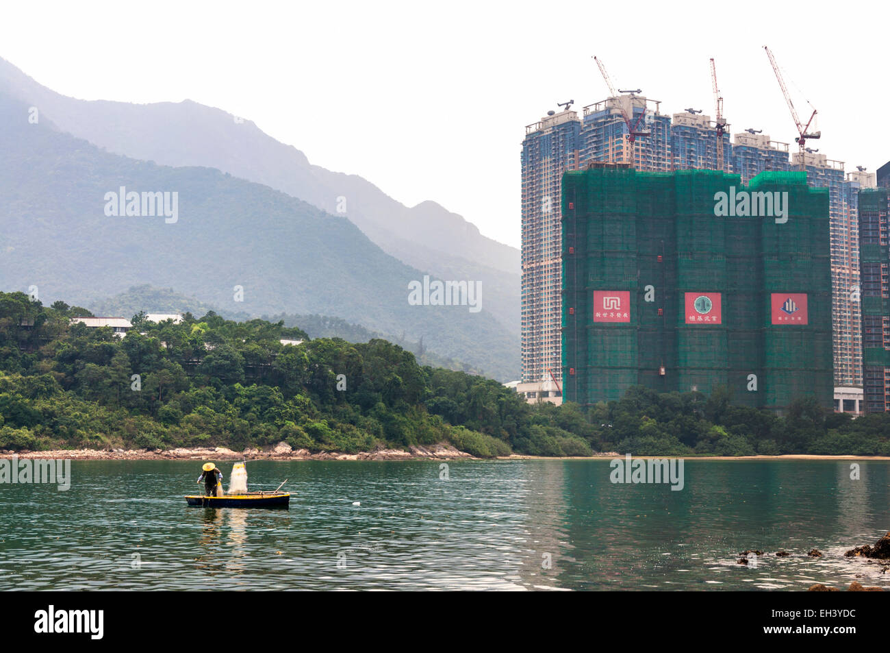 Fisherman and his boat at Star Fish Bay, Sha Tin, New Territories, Hong ...