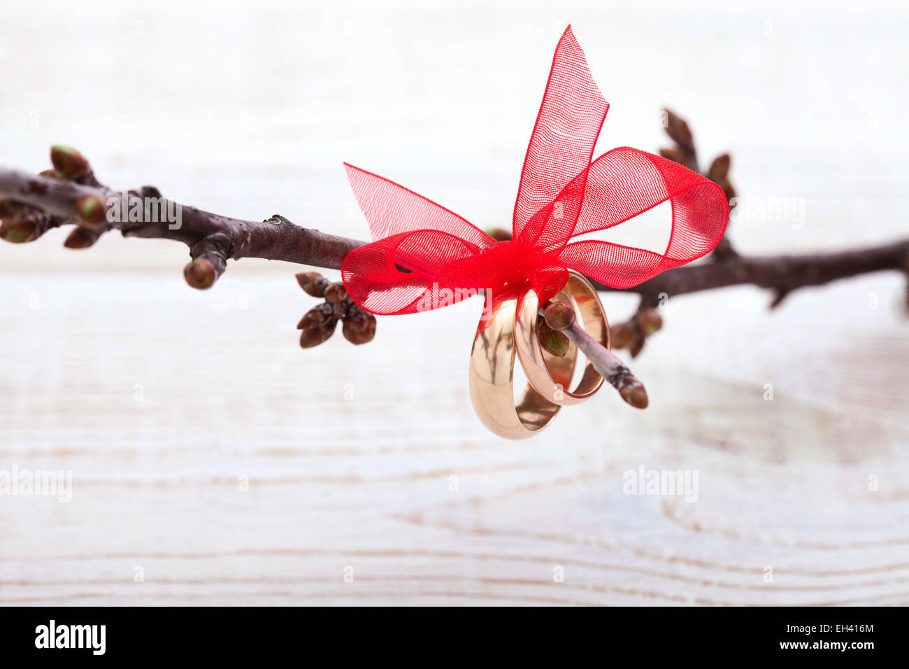 Wedding decoration rings with red ribbon Stock Photo - Alamy