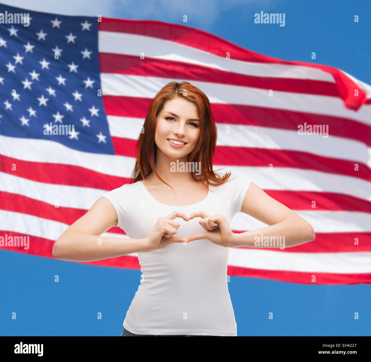 smiling girl showing heart with hands Stock Photo - Alamy
