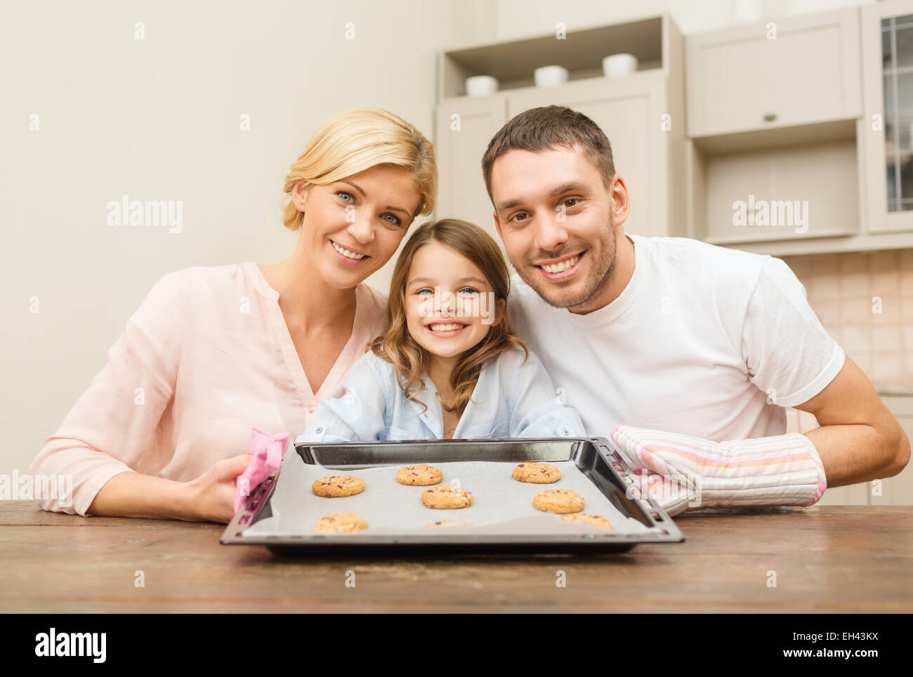 happy family making cookies at home Stock Photo - Alamy