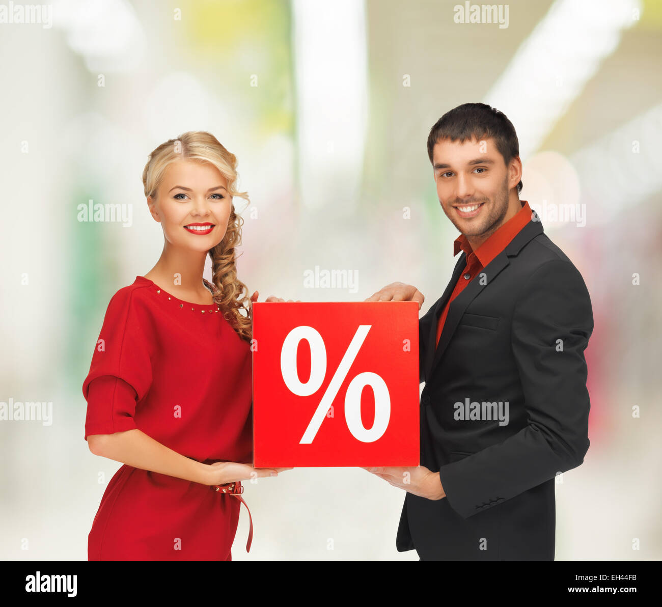 smiling man and woman with percent sign Stock Photo - Alamy