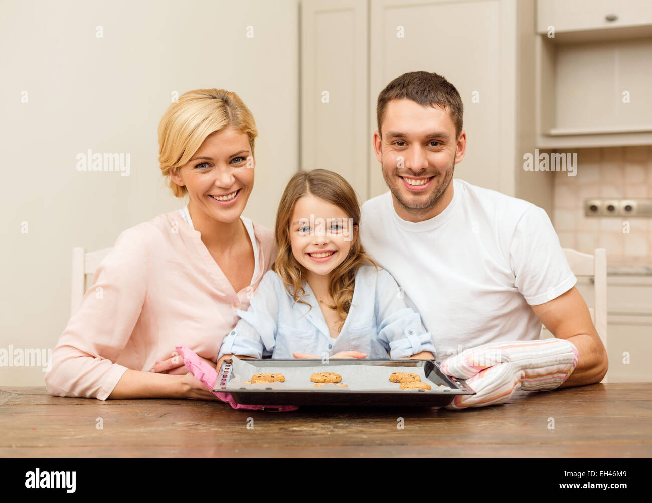 happy family making cookies at home Stock Photo - Alamy