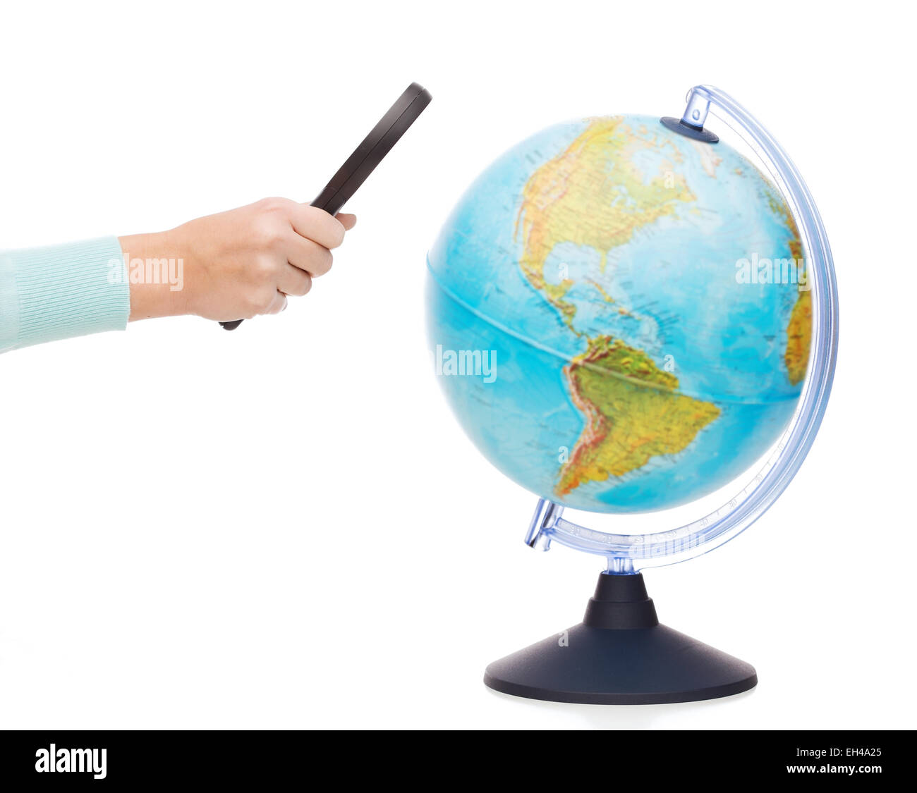 woman hand holding magnifying glass over globe Stock Photo - Alamy