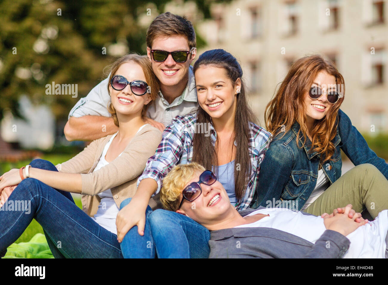 group of students or teenagers hanging out Stock Photo - Alamy