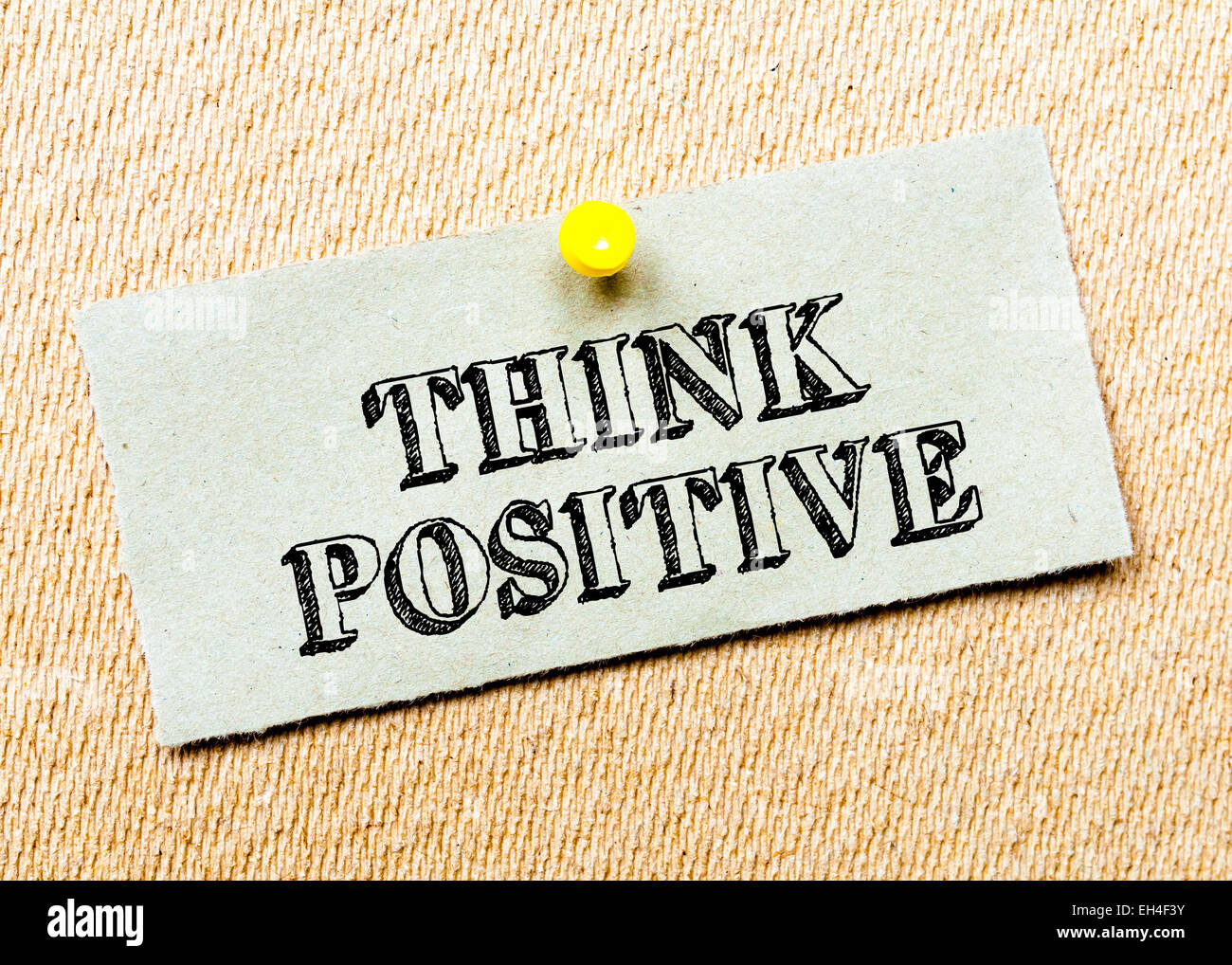 Recycled paper note pinned on cork board.Think positive Message ...