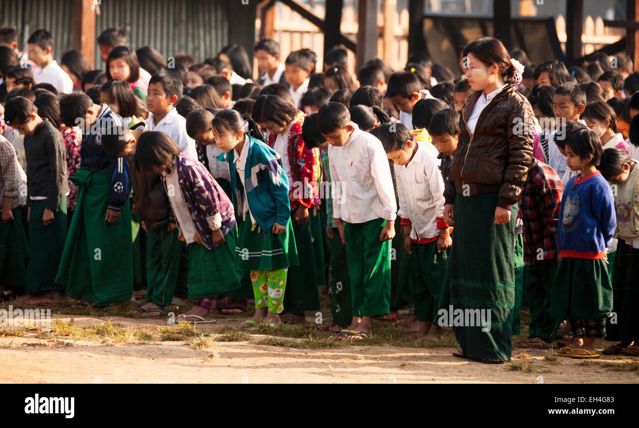Burmese schoolchildren and their teacher at morning assembly, Kay Lar ...