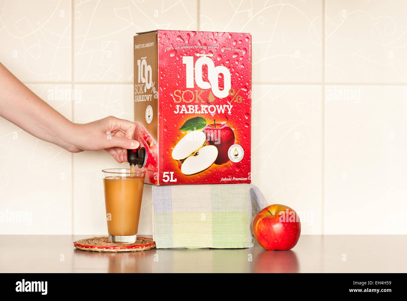 Pasteurised apple juice spouting Stock Photo - Alamy