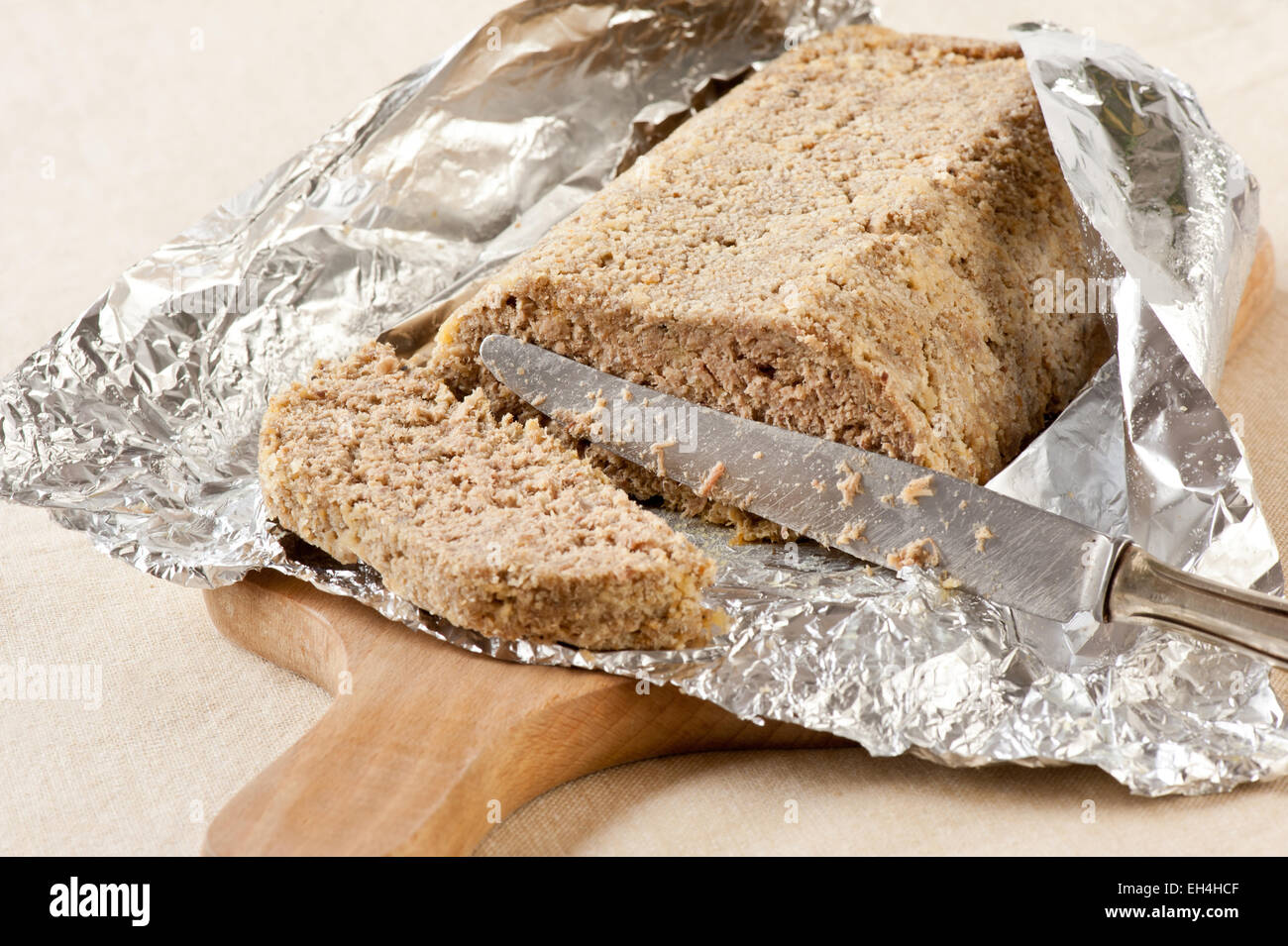 Home made poultry pate knife slicing Stock Photo - Alamy