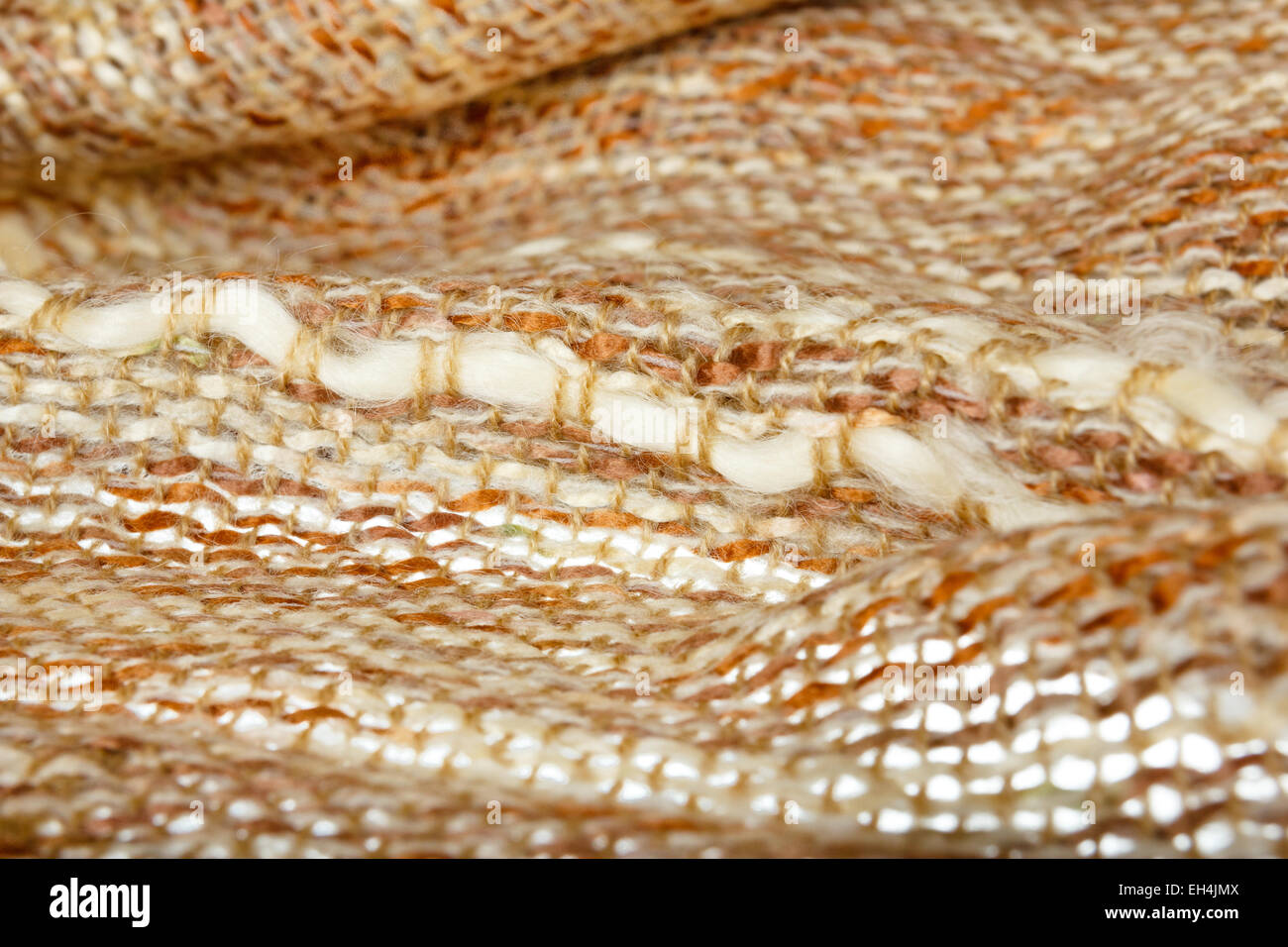 Threaded scarf texture in warm colours , Handmade textile pattern of ...