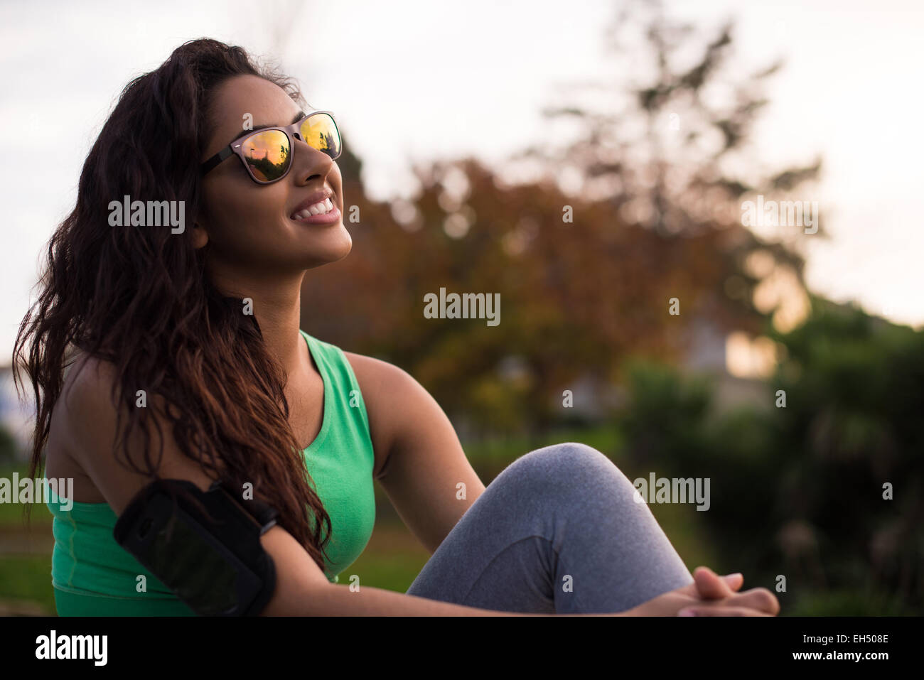Fitness runner woman relaxing in the city park Stock Photo - Alamy