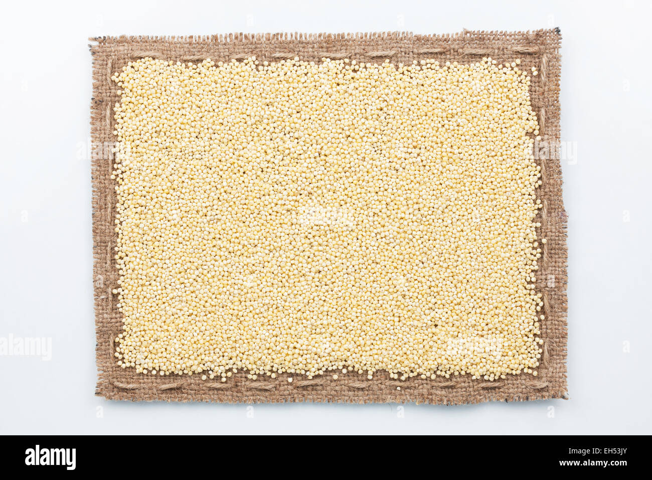 Frame of burlap and millet grain, lying on a white background Stock ...