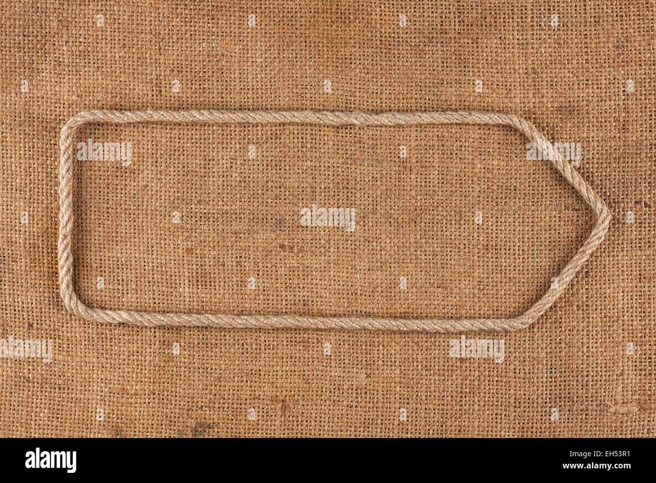 Arrow made of rope lying on burlap, as background, texture Stock Photo ...