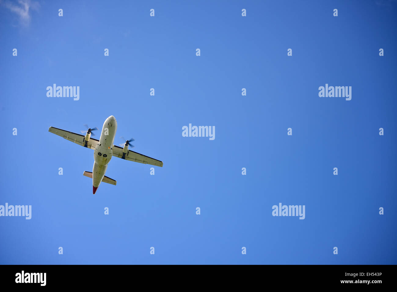 Propeller airplane flying in the sky Stock Photo - Alamy