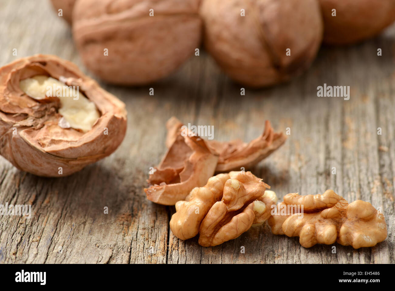 Nuts placed on a wooden texture in natural light Stock Photo - Alamy
