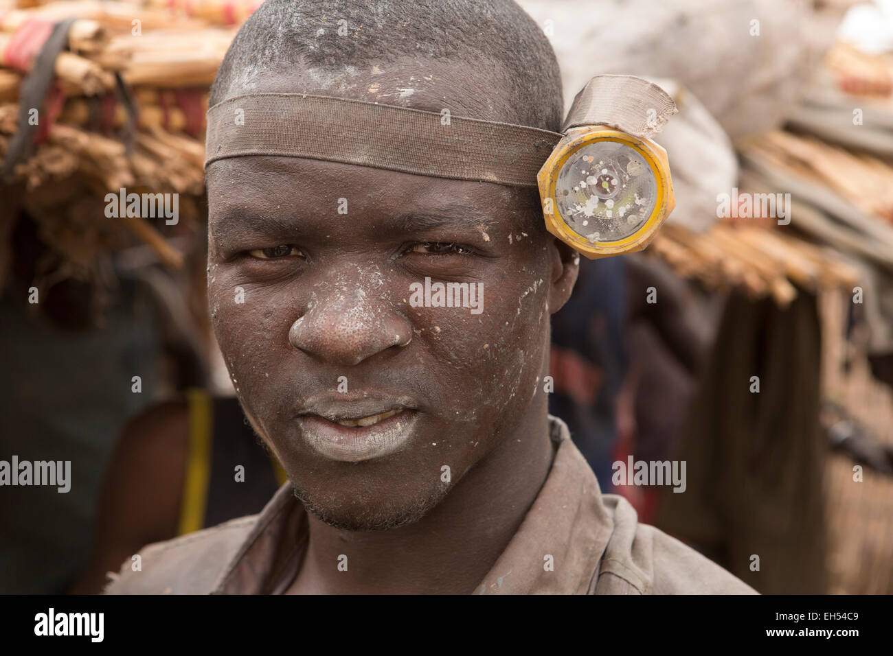 KOMOBANGAU, NIGER, : A miner wearing his head torch beside the vertical ...