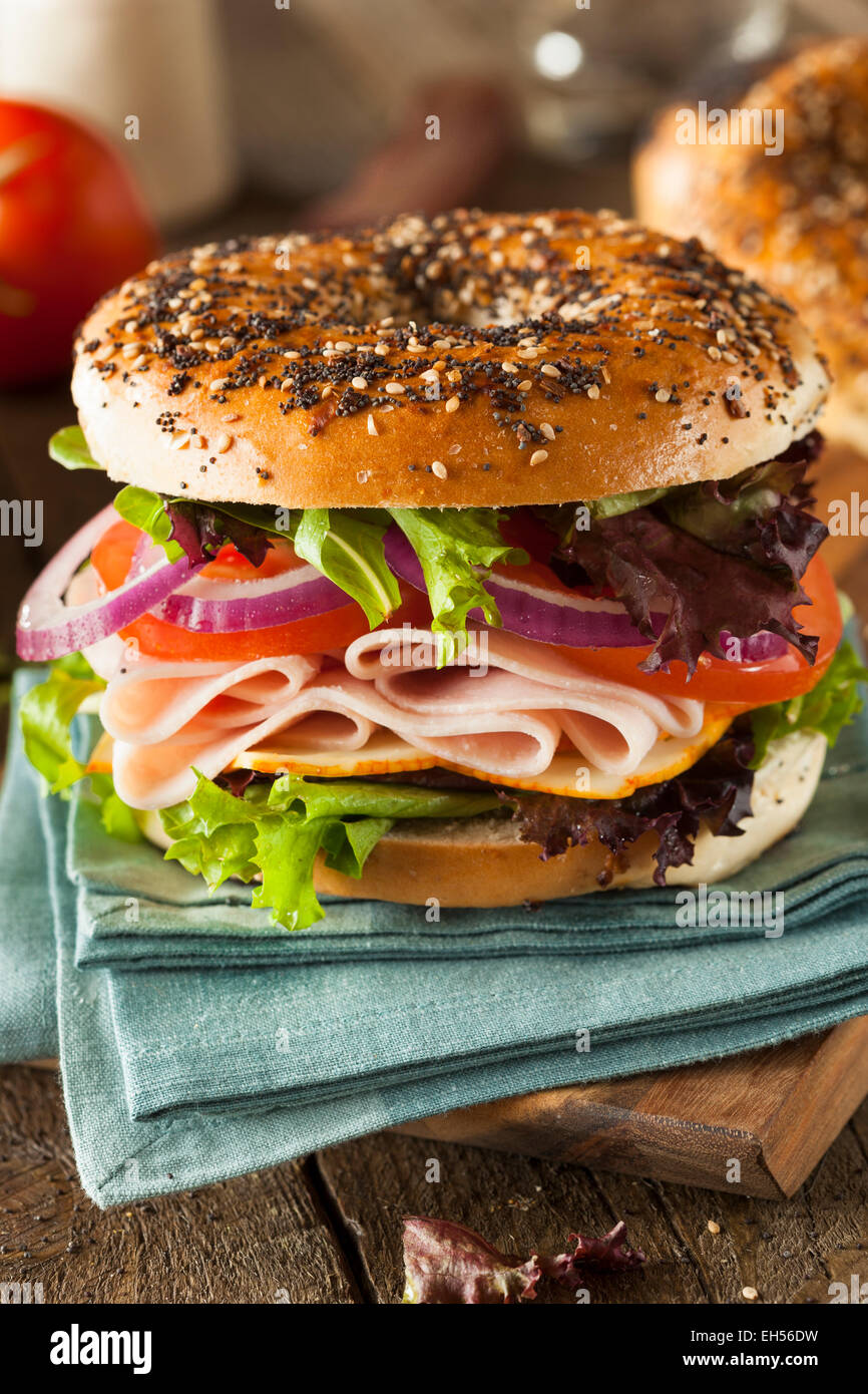 Healthy Turkey Sandwich on a Bagel with Lettuce and Tomato Stock Photo ...
