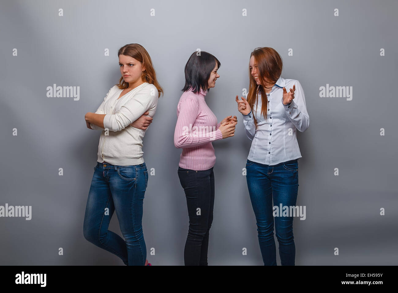 two girls talking European appearance and ignore the third girlfriend ...
