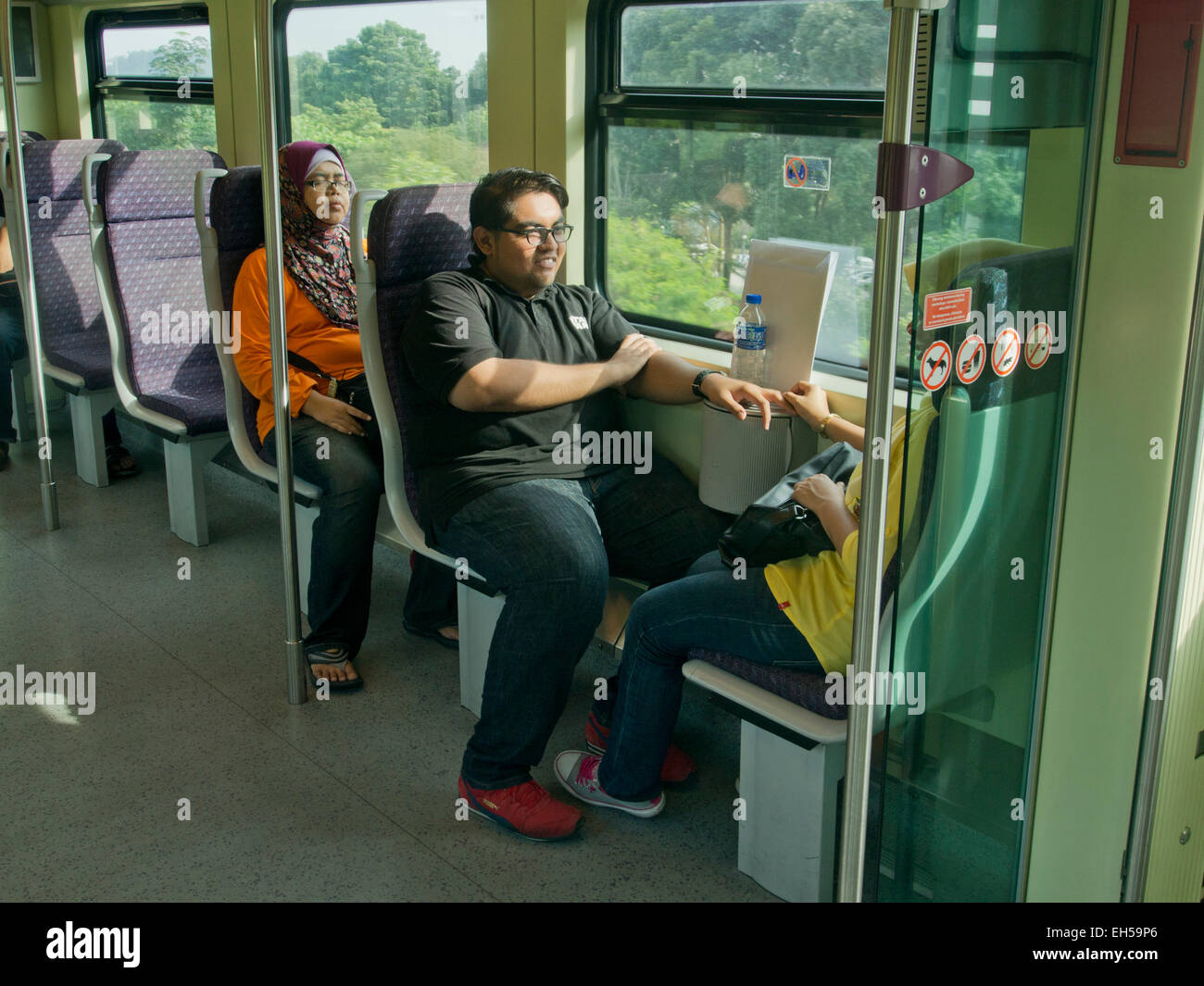 Passengers on fast shuttle train from Kuala Lumpur international ...