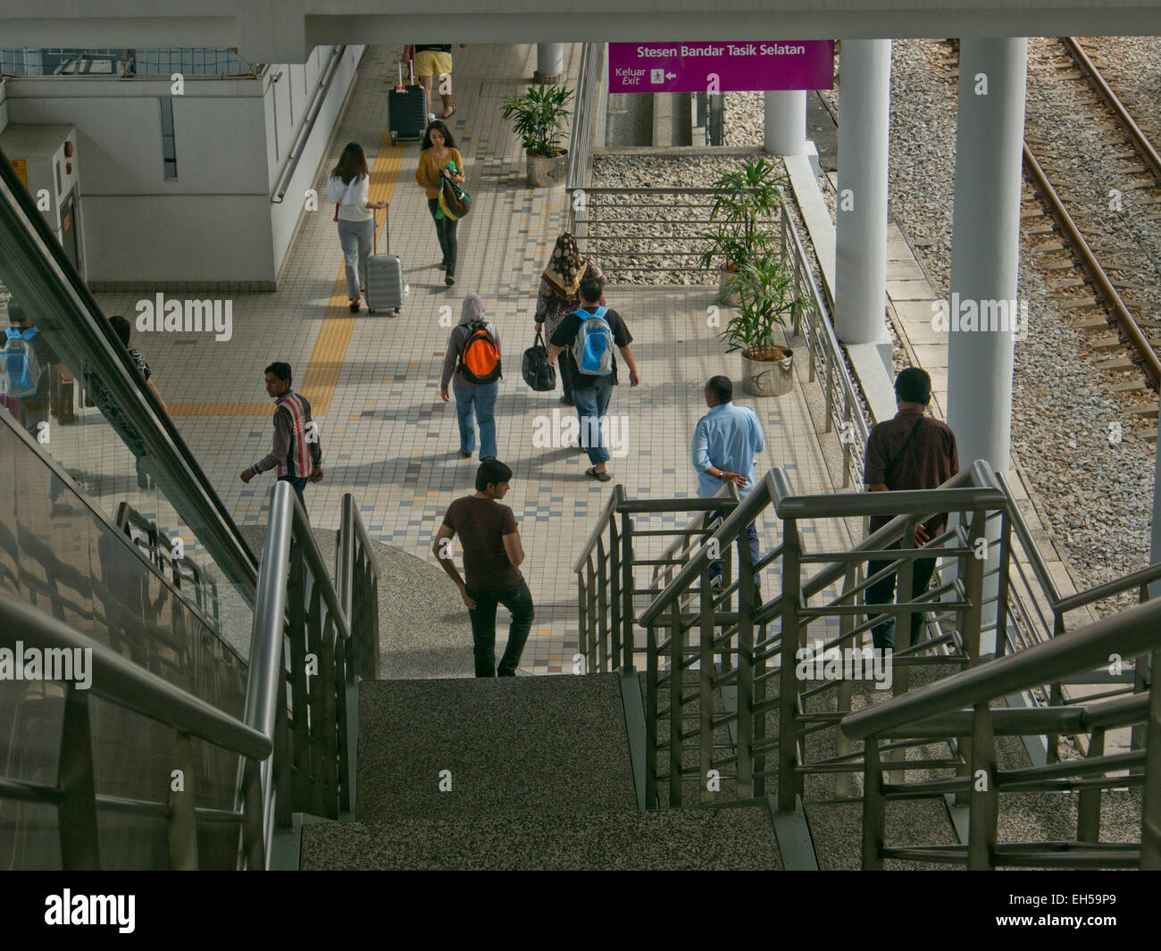 Passengers on station along route of fast shuttle train from Kuala ...