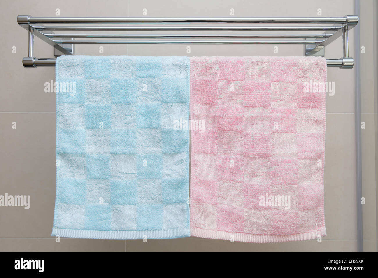 two towels and shelf in bathroom Stock Photo - Alamy