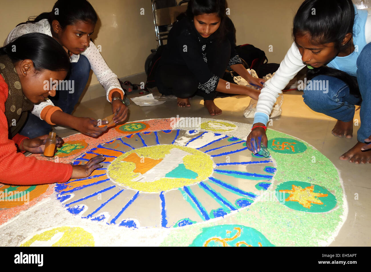 young Indian People making Rangoli from colored powder Stock Photo - Alamy